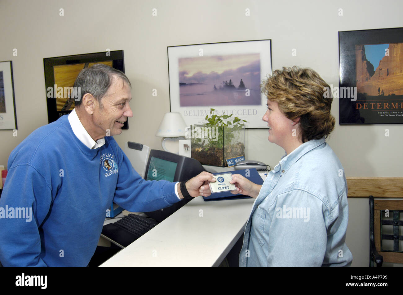 Middle school principal checks identification of female visiting school ...