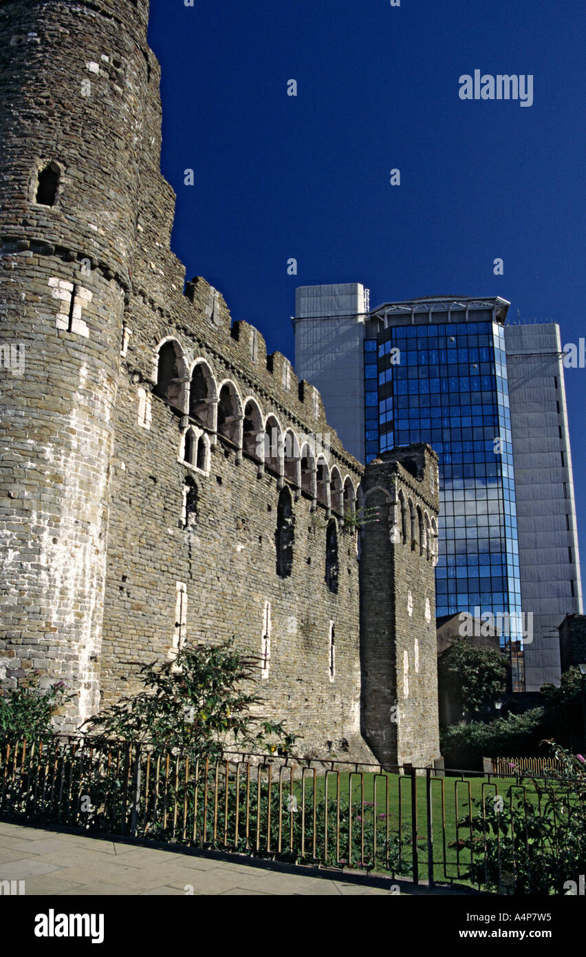 Modern and old architecture with Cardiff castle walls in the foreground ...