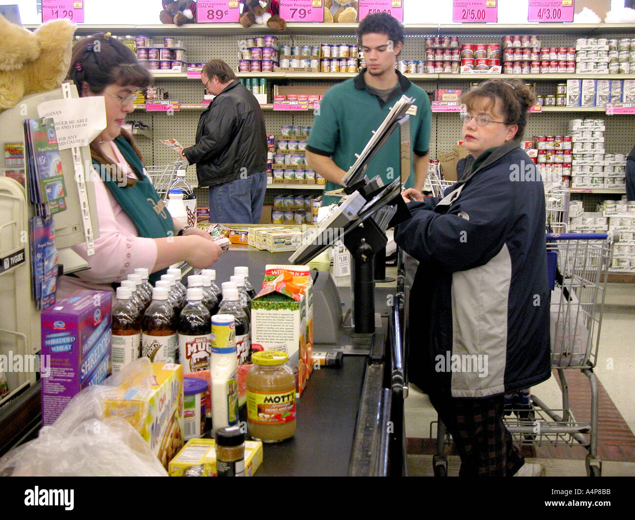 Activity at a grocery super market check out line Stock Photo - Alamy