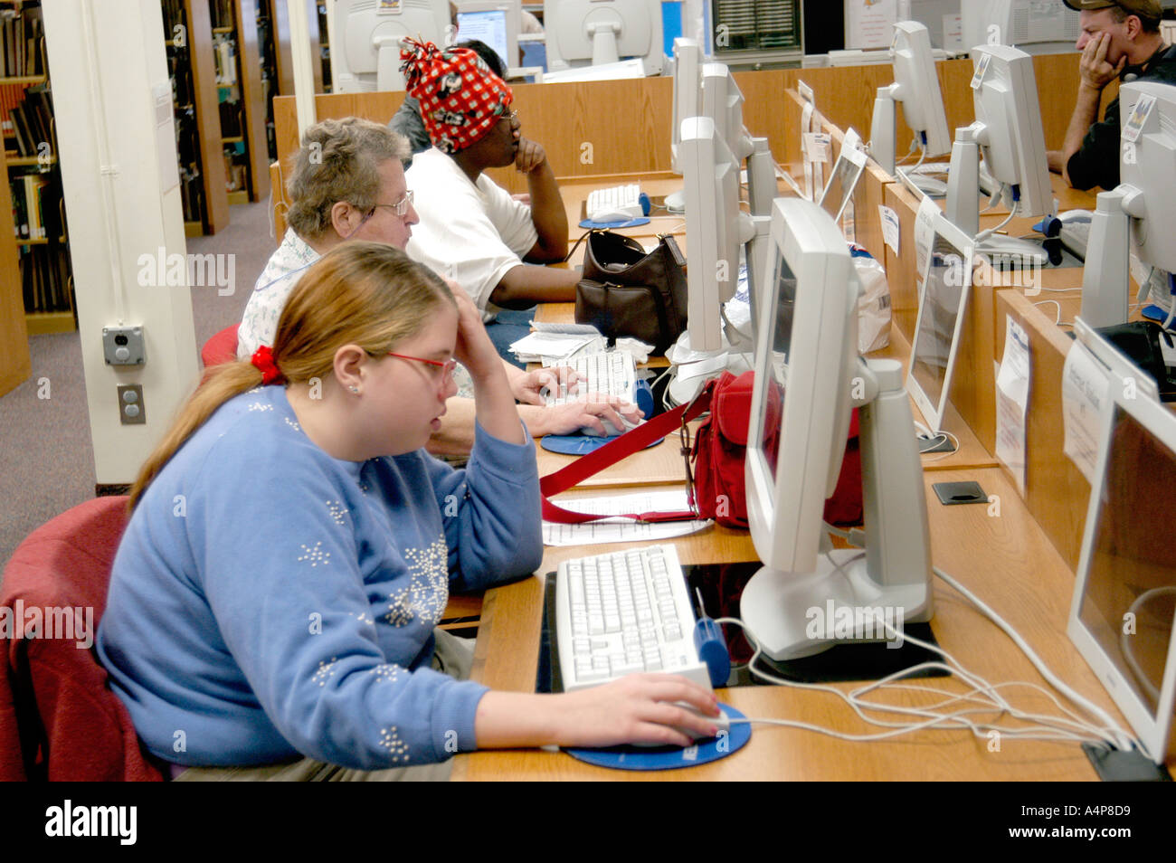 Adults surf the internet for free at a public library Stock Photo - Alamy