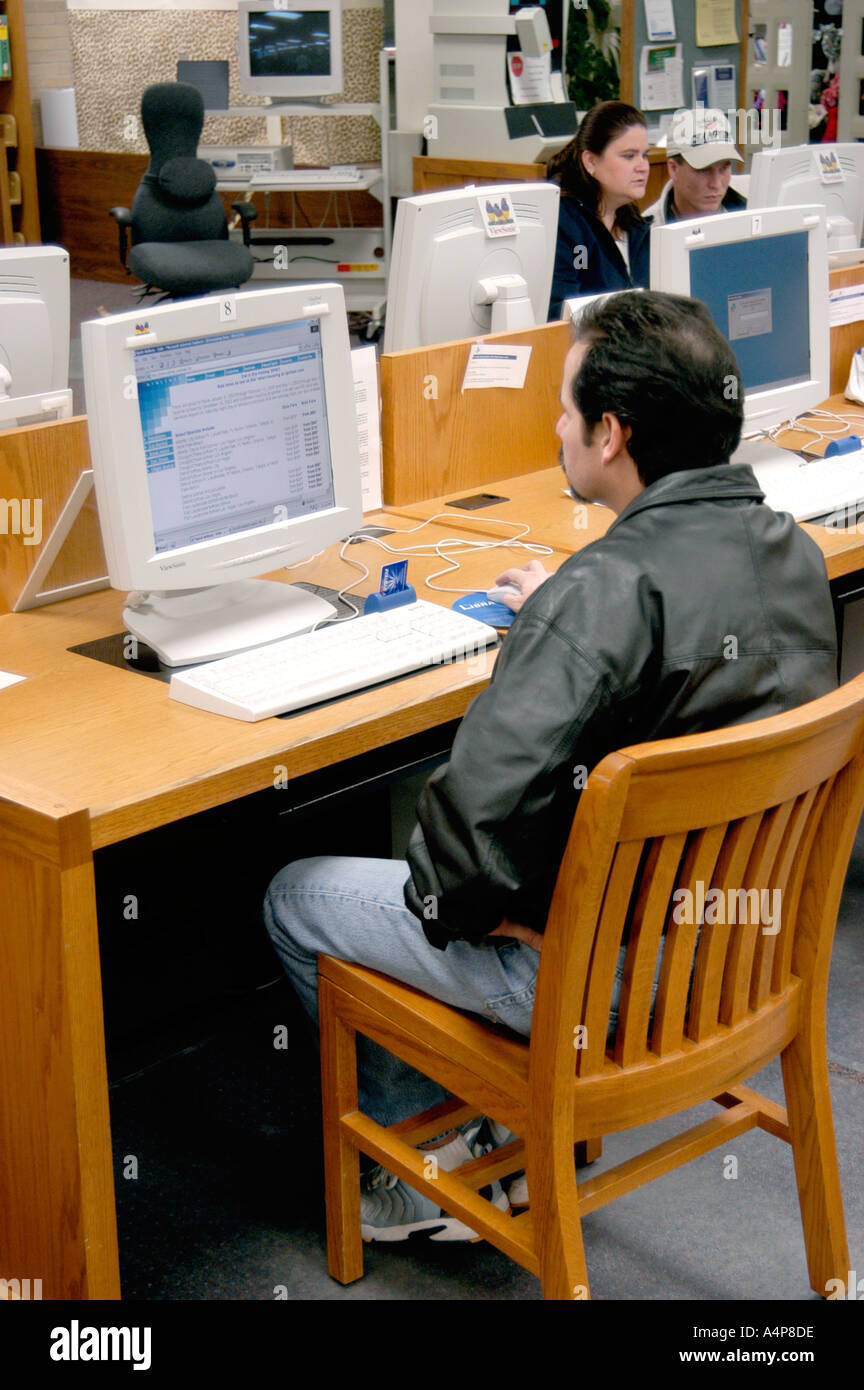 Adults surf the internet for free at a public library Stock Photo - Alamy