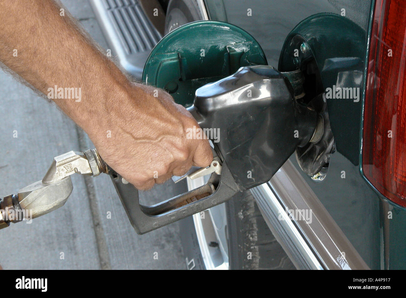 Female pumping gas hi-res stock photography and images - Alamy