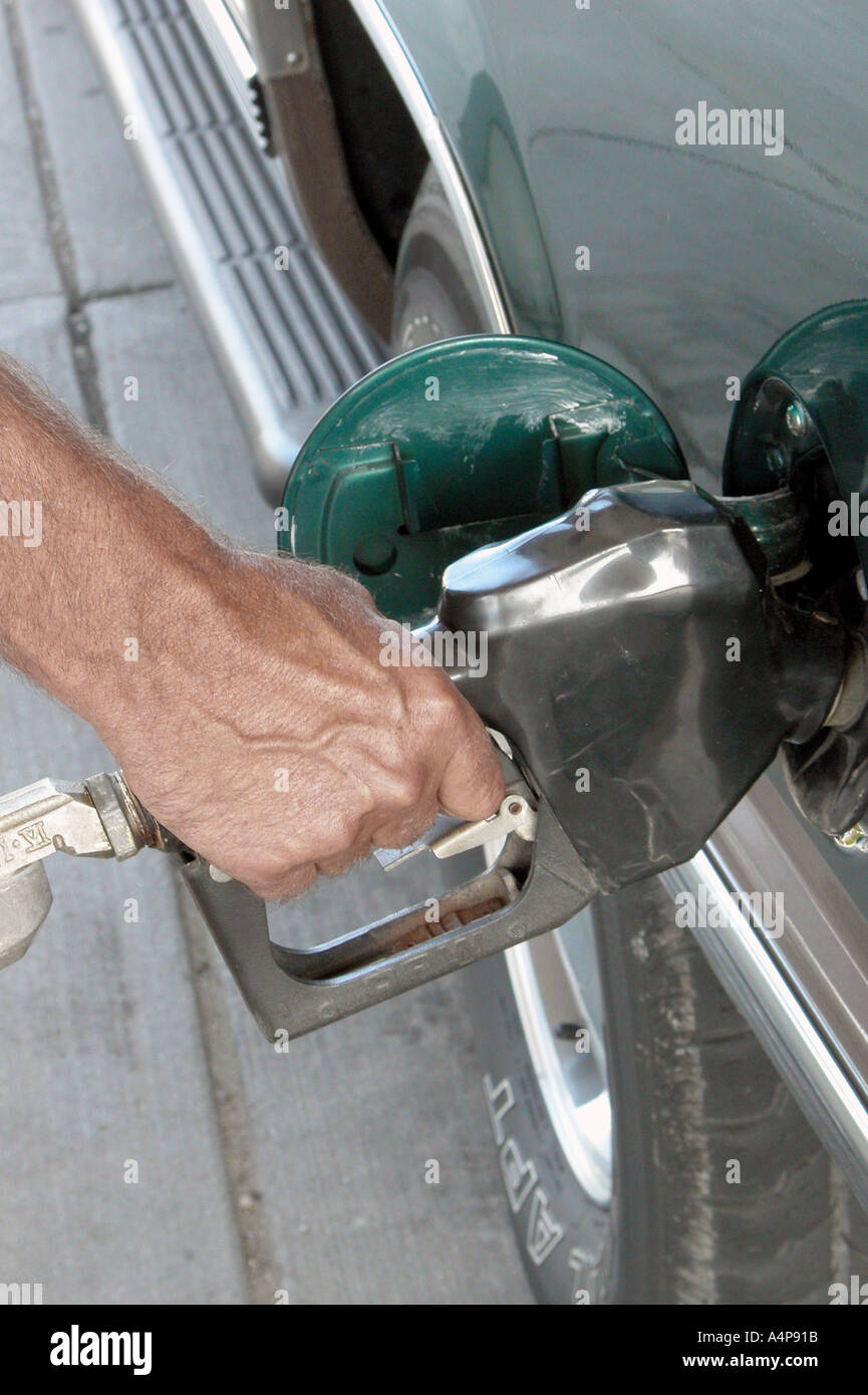 Female pumping gas hi-res stock photography and images - Alamy
