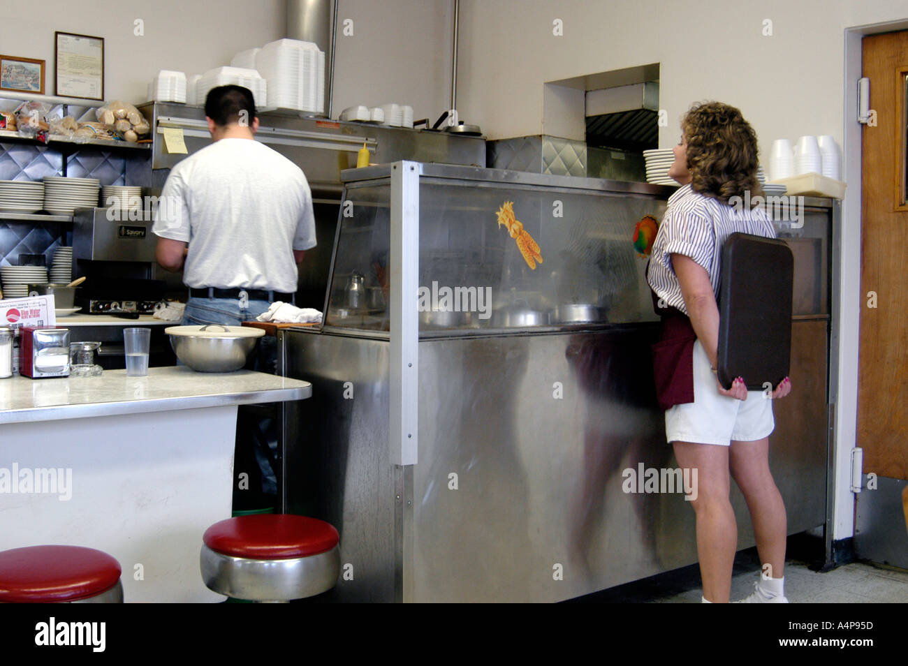 Activities in a small family restaurant Stock Photo - Alamy