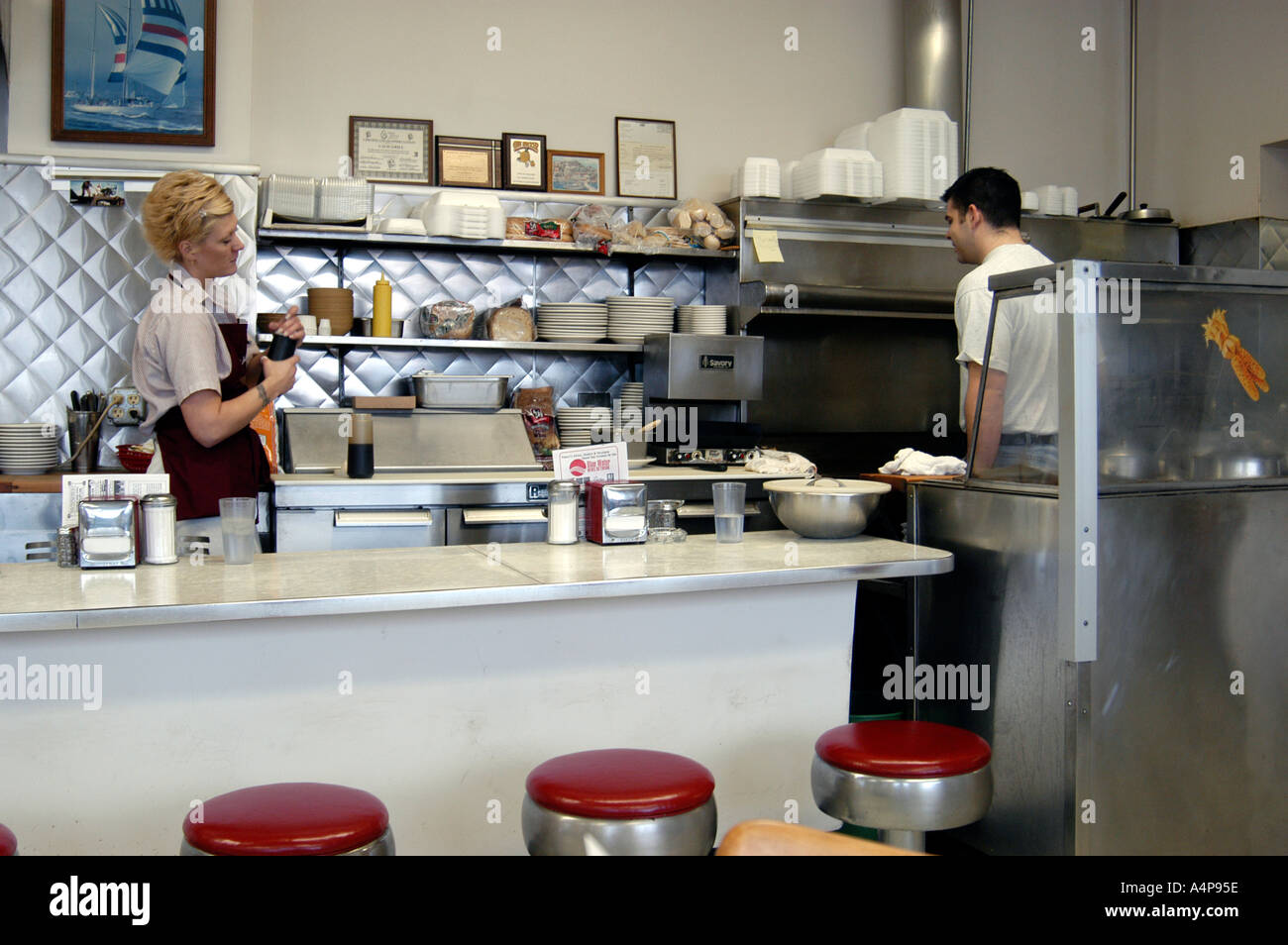 Activities in a small family restaurant Stock Photo - Alamy