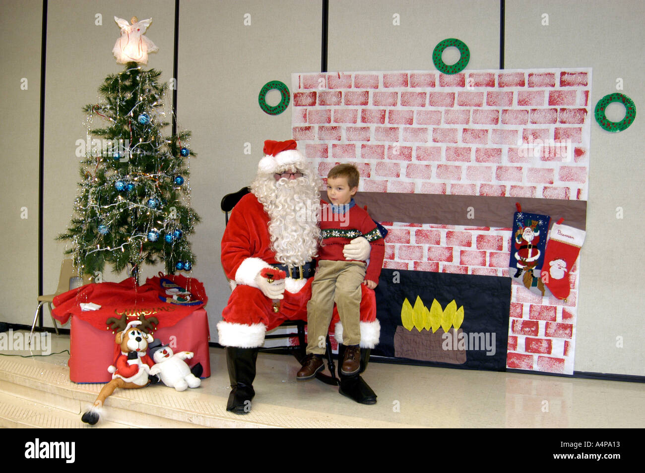 Girl sitting on lap of santa hi-res stock photography and images - Alamy