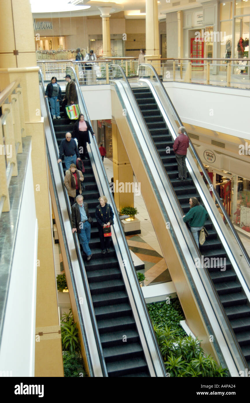 Escalators move shoppers in a large mall complex Stock Photo - Alamy