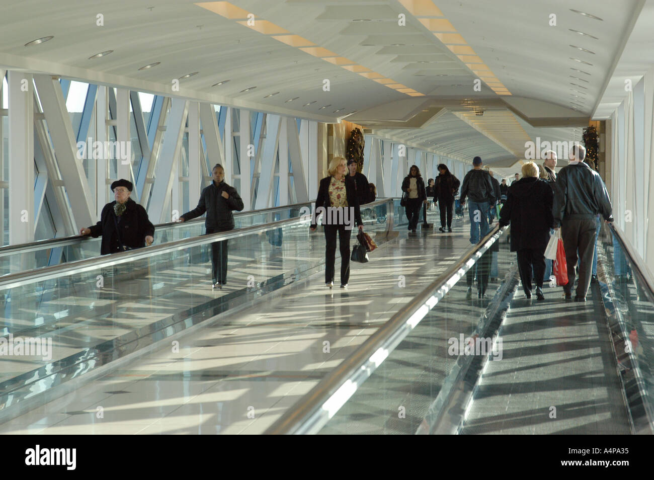Escalators move shoppers in a large mall complex Stock Photo - Alamy