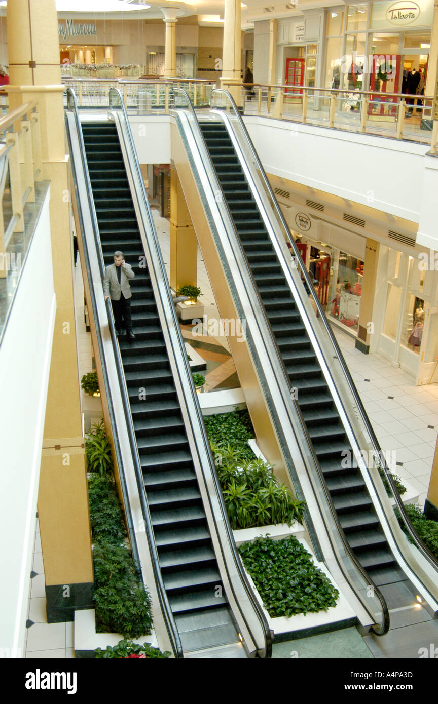 Escalators move shoppers in a large mall complex Stock Photo - Alamy