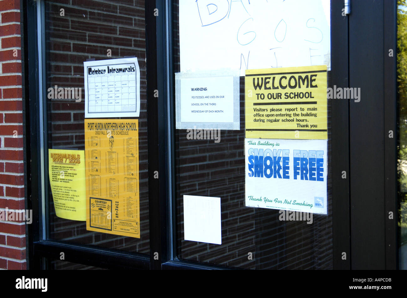 Middle school with sign on the door stating a smoke free building Stock ...