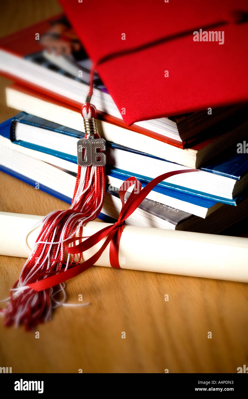 School books graduation cap tassel and diploma Stock Photo - Alamy
