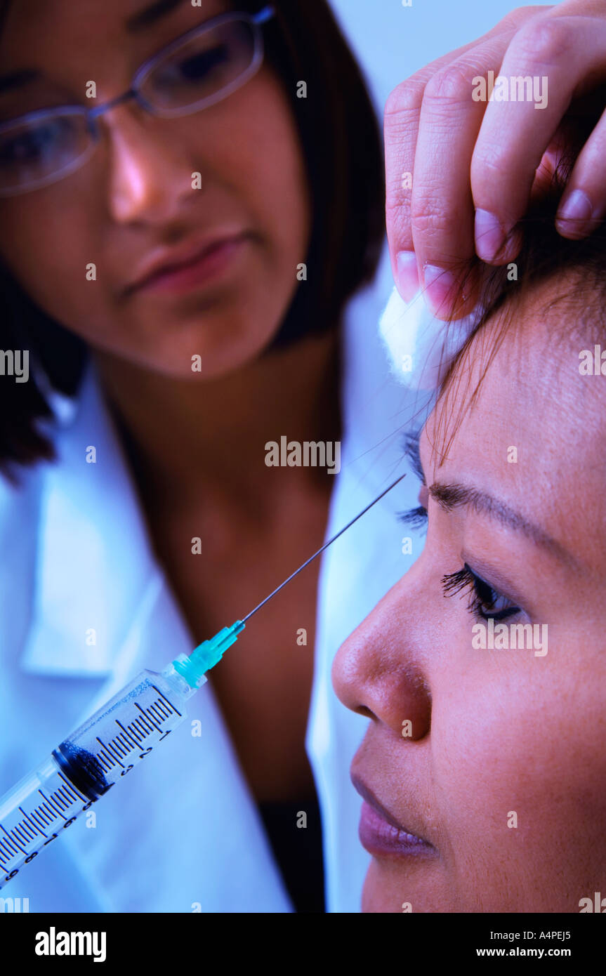 Dermatologist injecting botox injection hi-res stock photography and ...