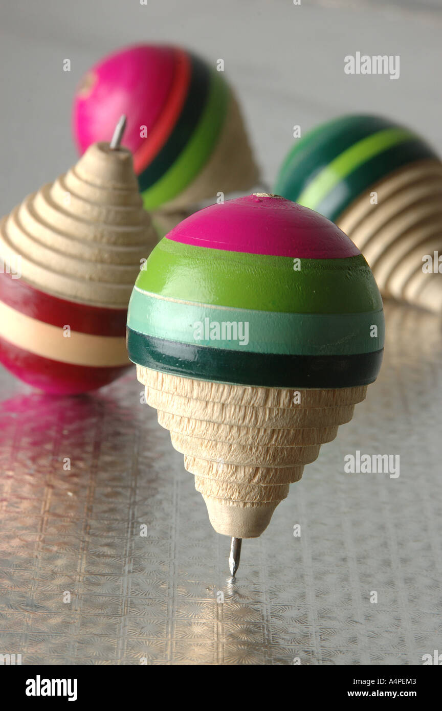 Three spinning tops hi-res stock photography and images - Alamy