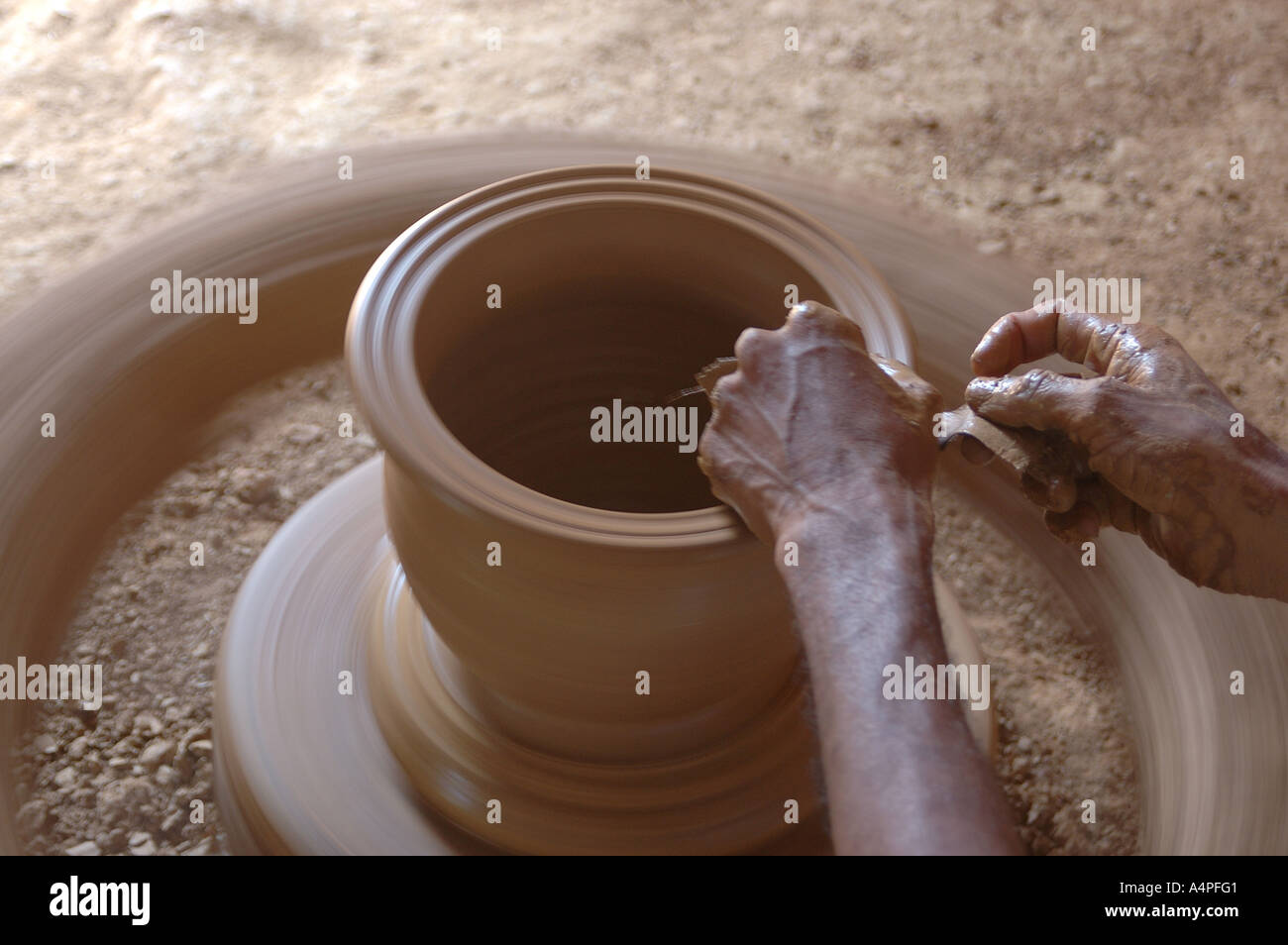 Potter making earthen clay pot on potters wheel India Stock Photo - Alamy
