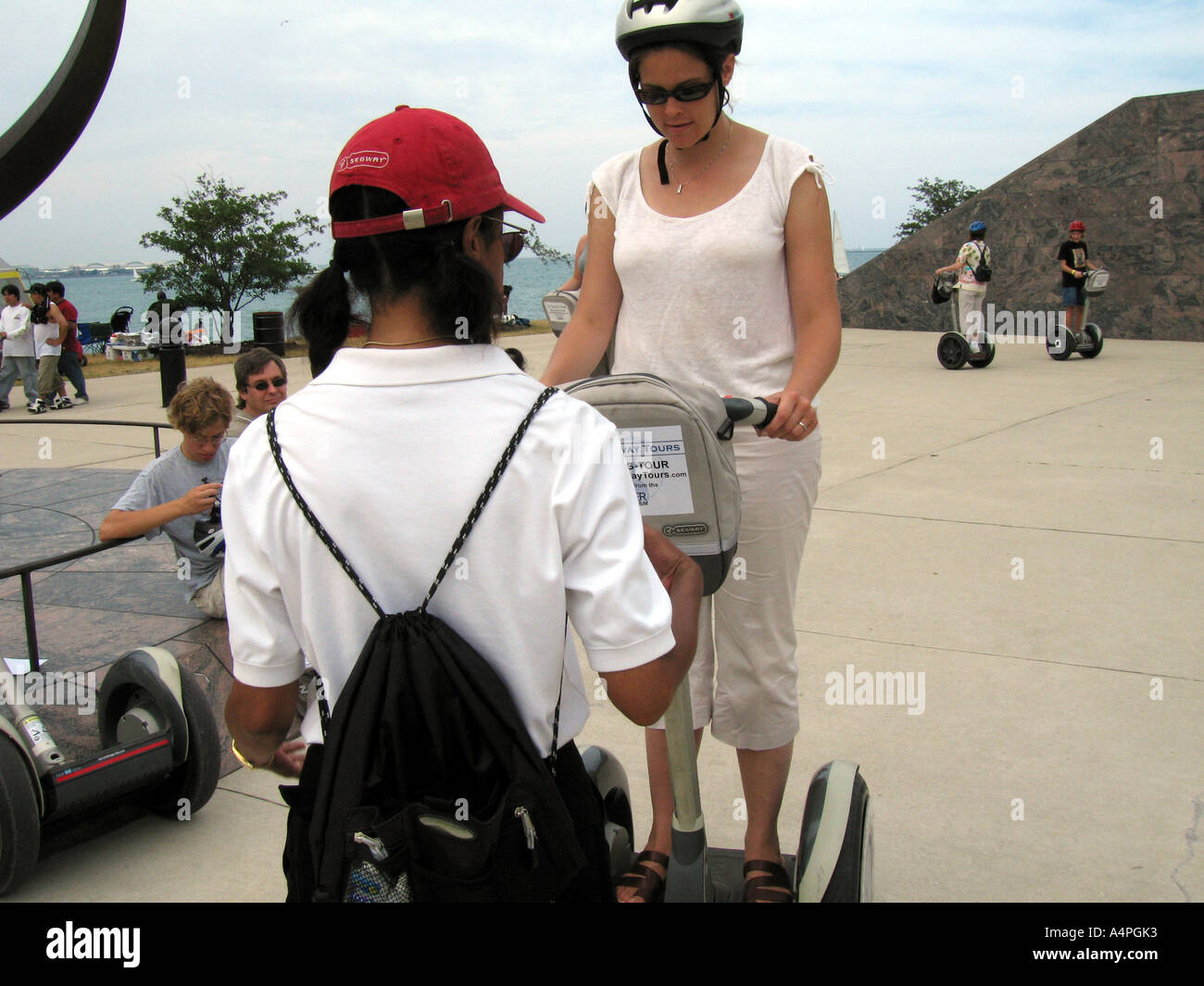 Woman learning to ride a segway personal transporter Stock Photo - Alamy