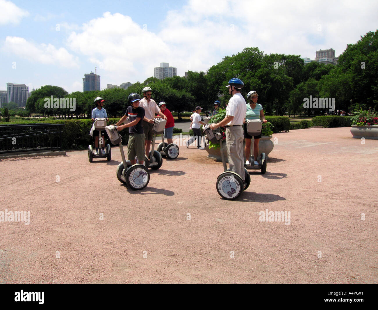 People riding segway personal transporters in a city Stock Photo - Alamy