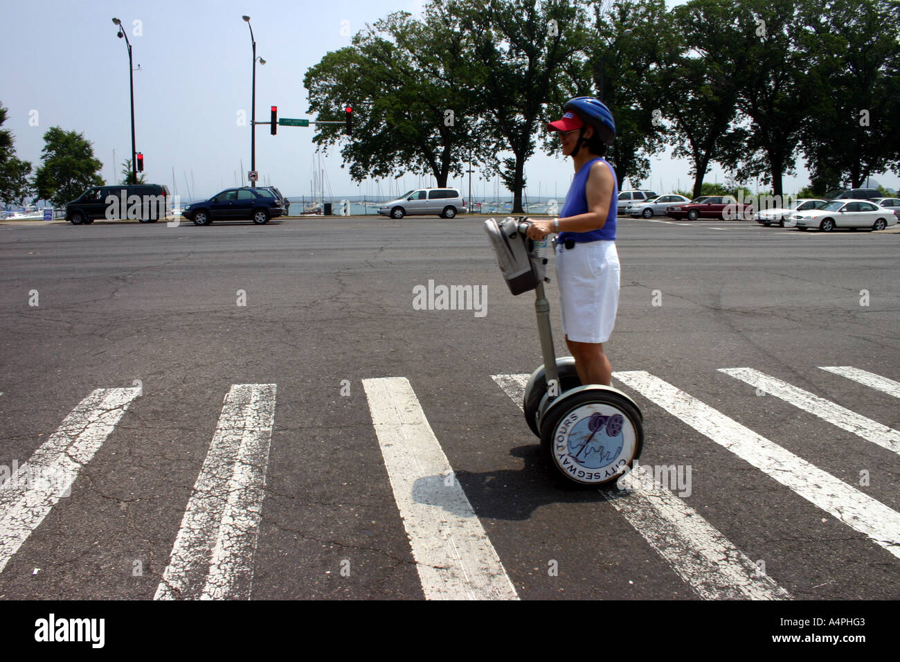 Woman riding electric personal transporter hi-res stock photography and ...
