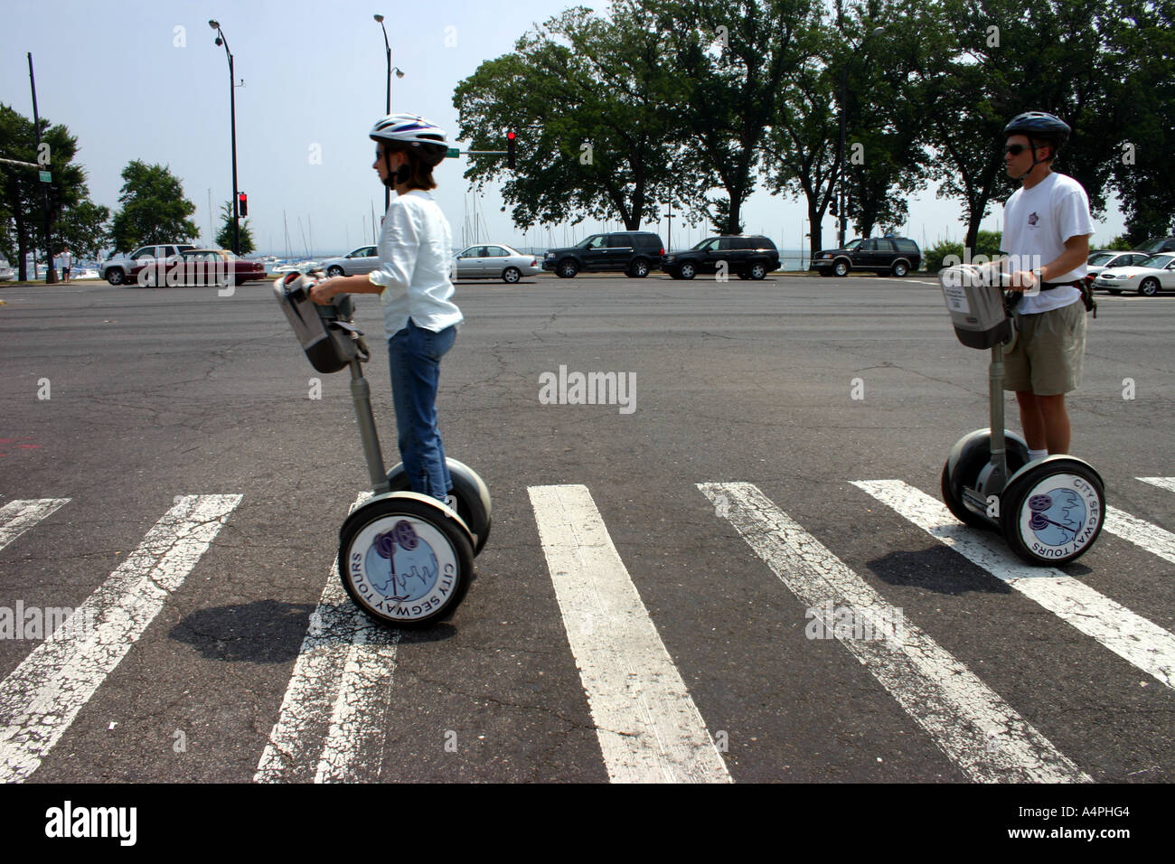 People riding Segway personal transporters across a crosswalk Chicago ...