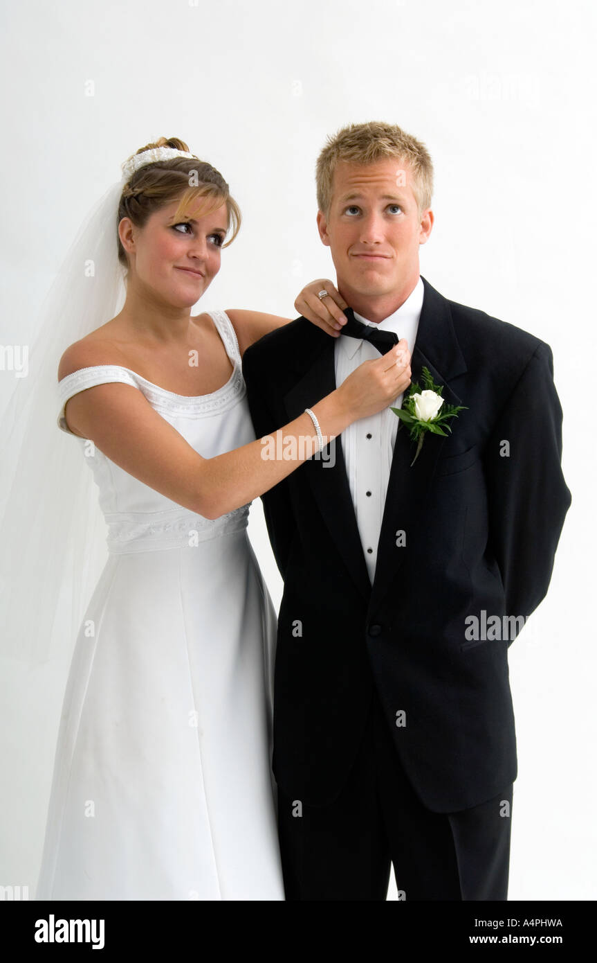 Bride fixing dress hi-res stock photography and images - Alamy