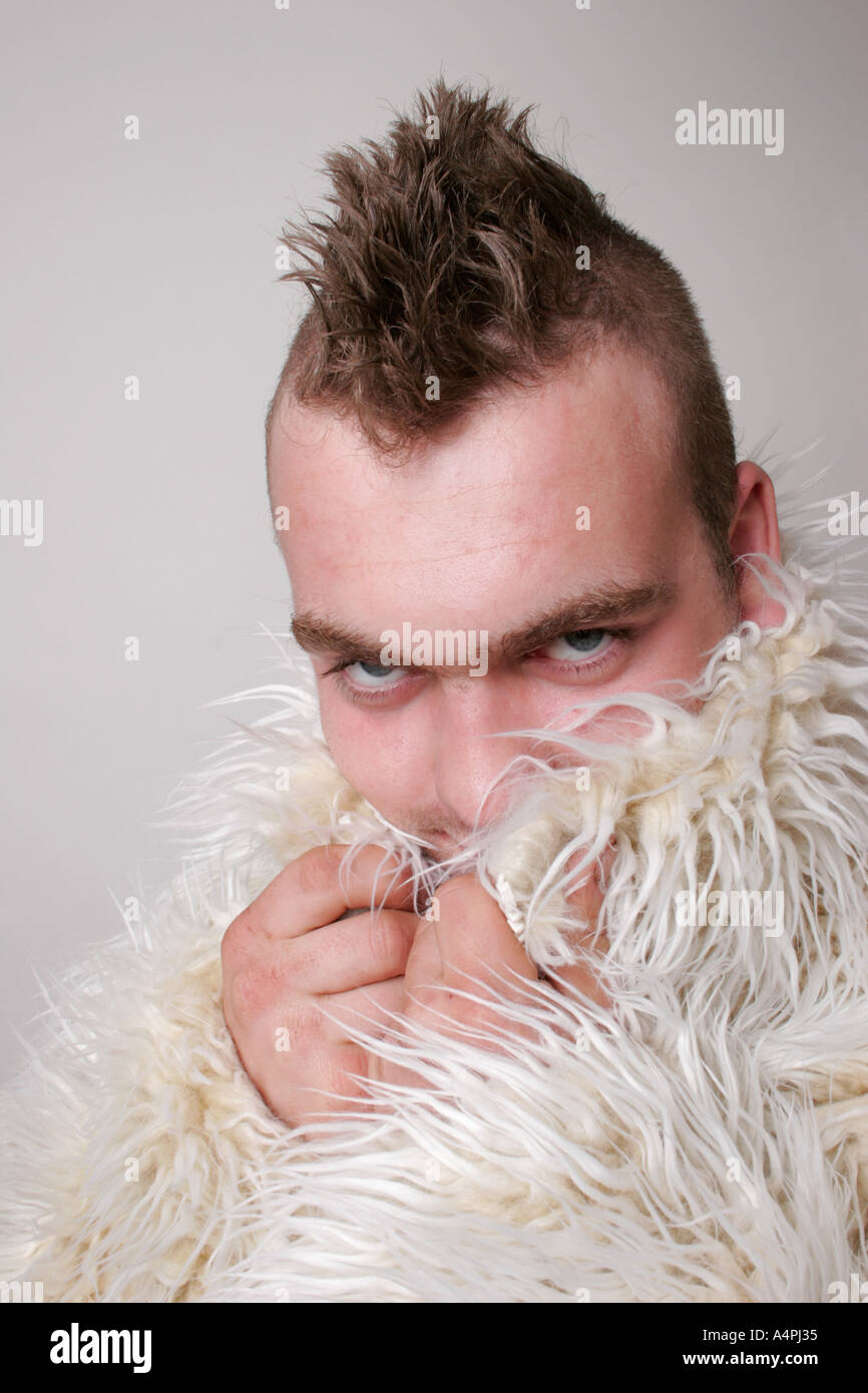 Mohican hair cut young man age between 20 and 25 wearing a fur coat ...