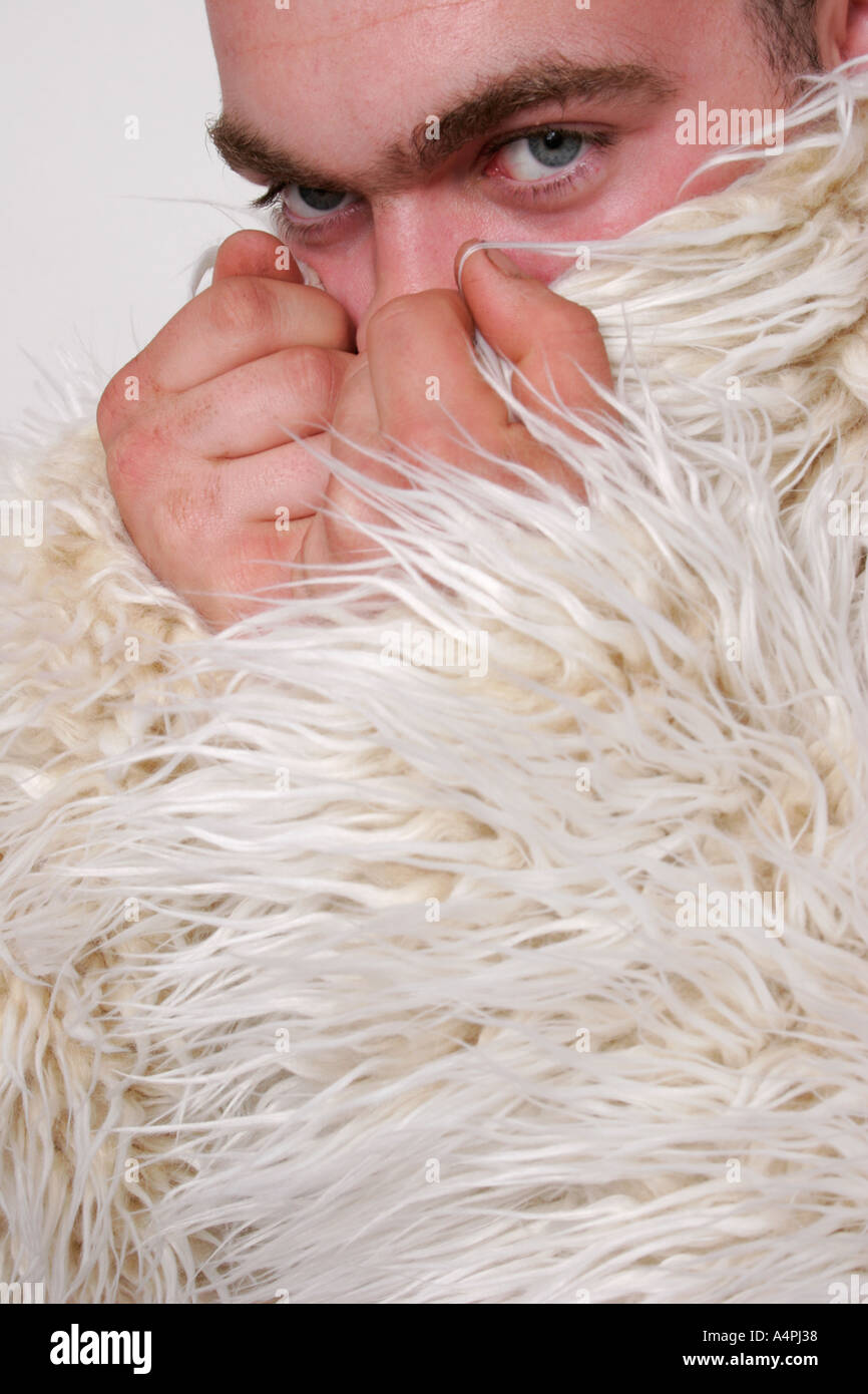 hair cut young man age between 20 and 25 wearing a fur coat shot in the ...