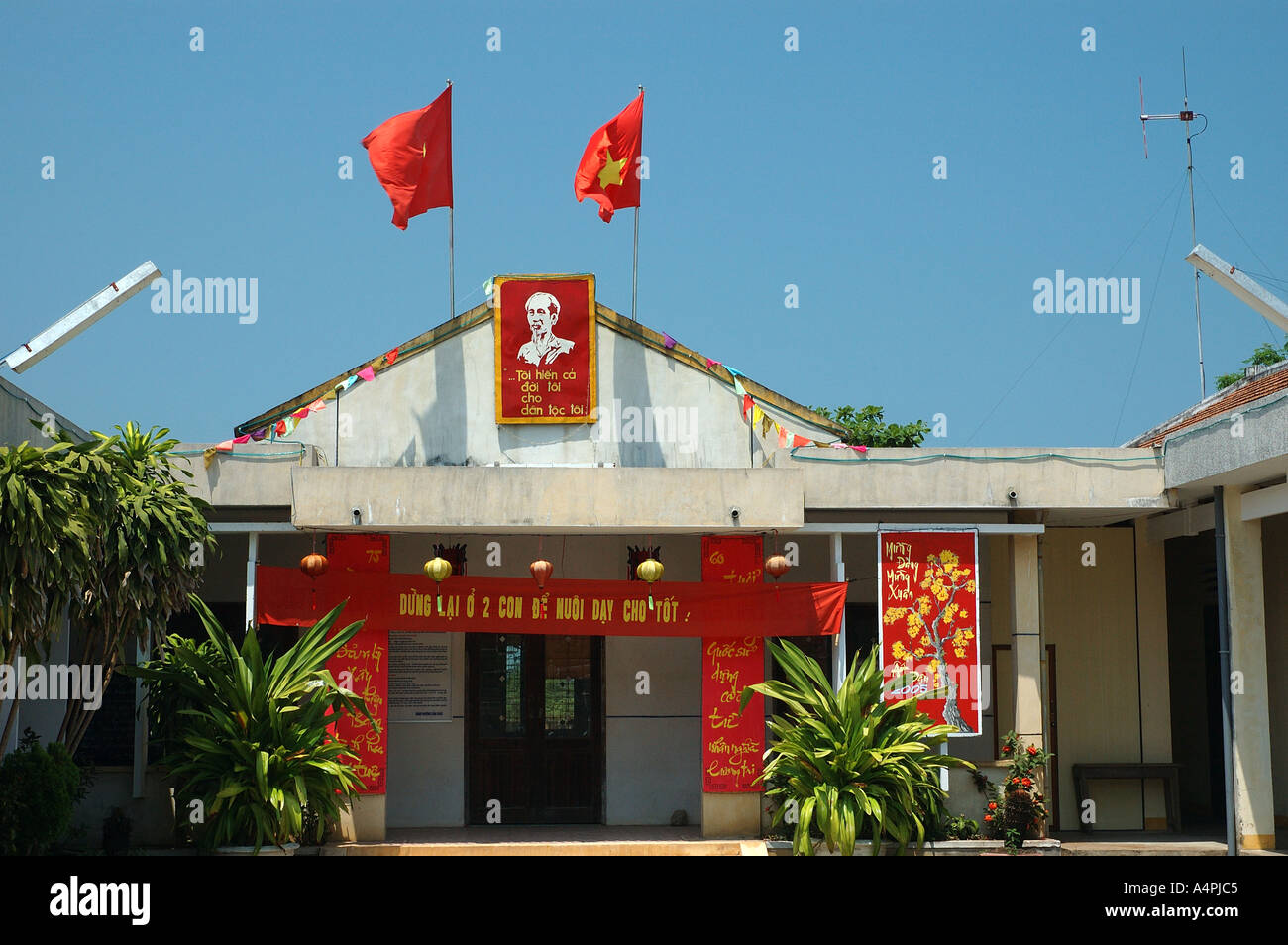 Uncle Ho Ho Chi Minh painting outside a school at Hoi An Vietnam South ...