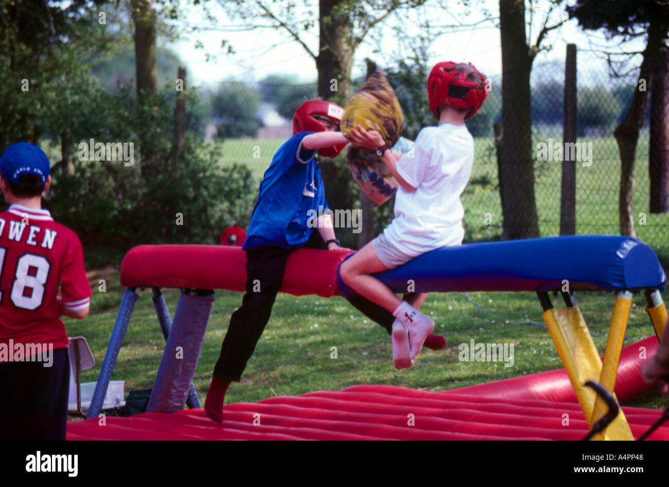 Children play fighting at fair Stock Photo - Alamy