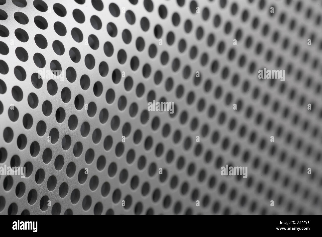Close up of a perforated metal surface Stock Photo - Alamy