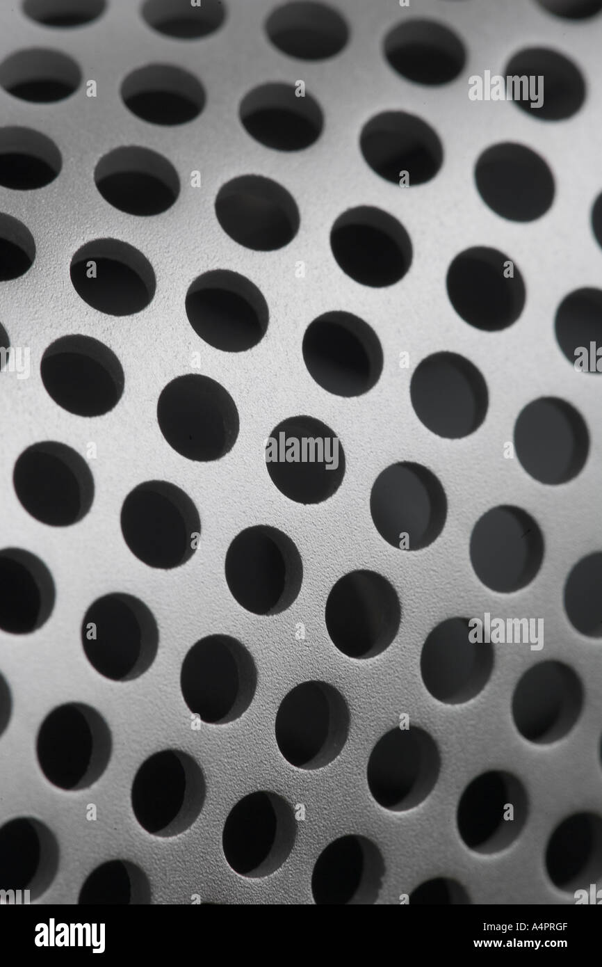 Close up of a perforated metal surface Stock Photo - Alamy