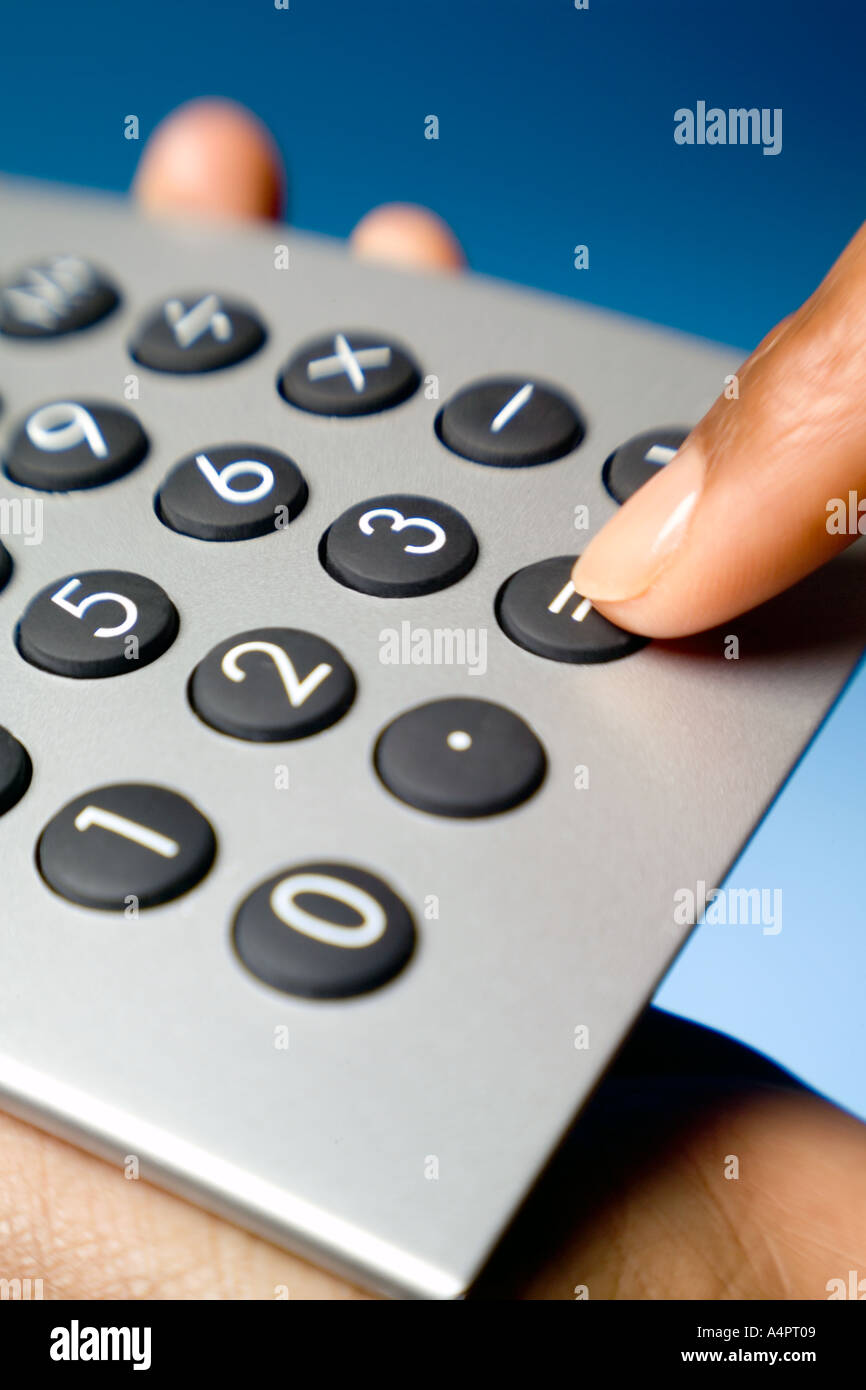 Hand with calculator hi-res stock photography and images - Alamy