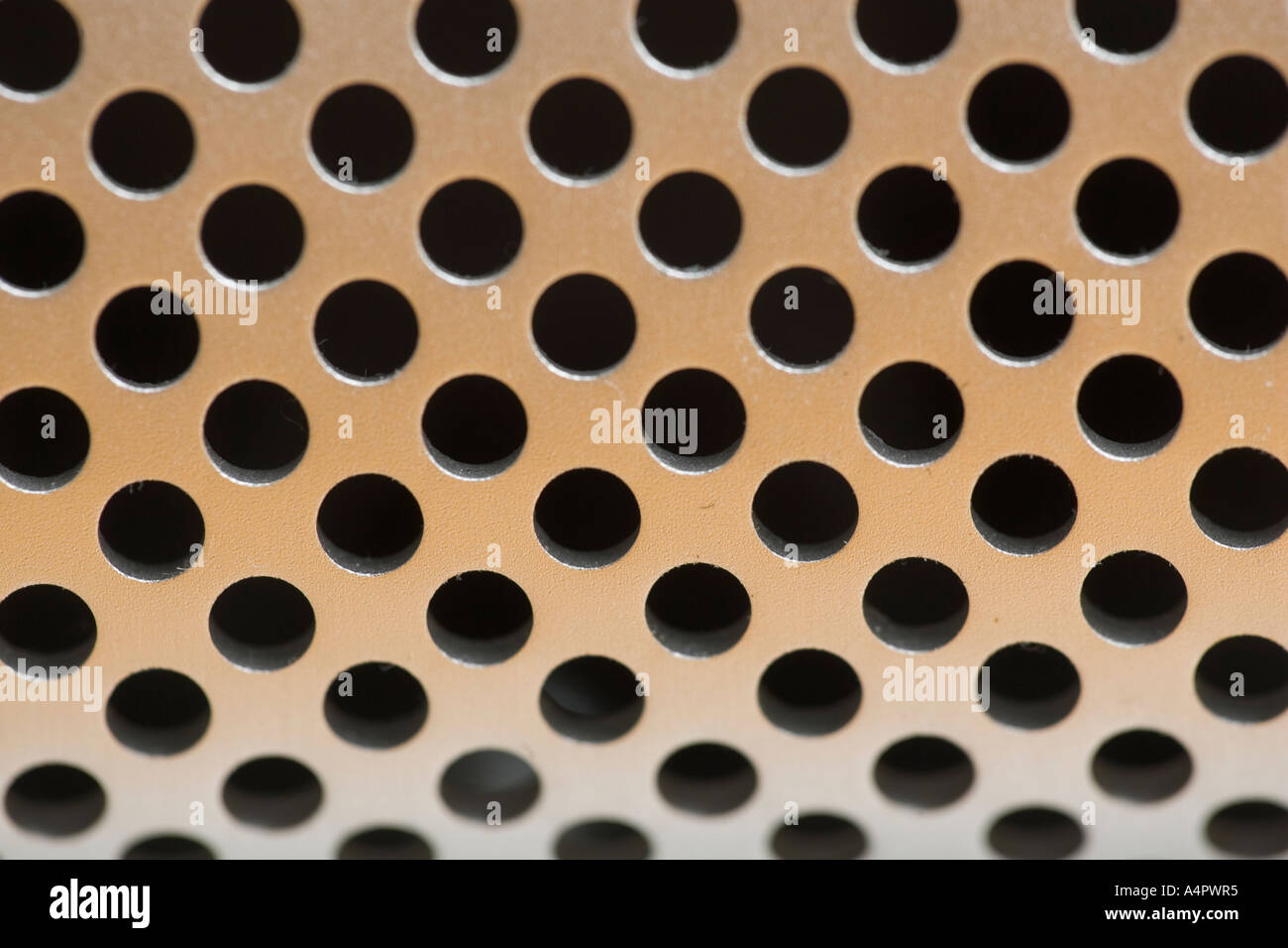 Close up of a perforated metal surface Stock Photo - Alamy