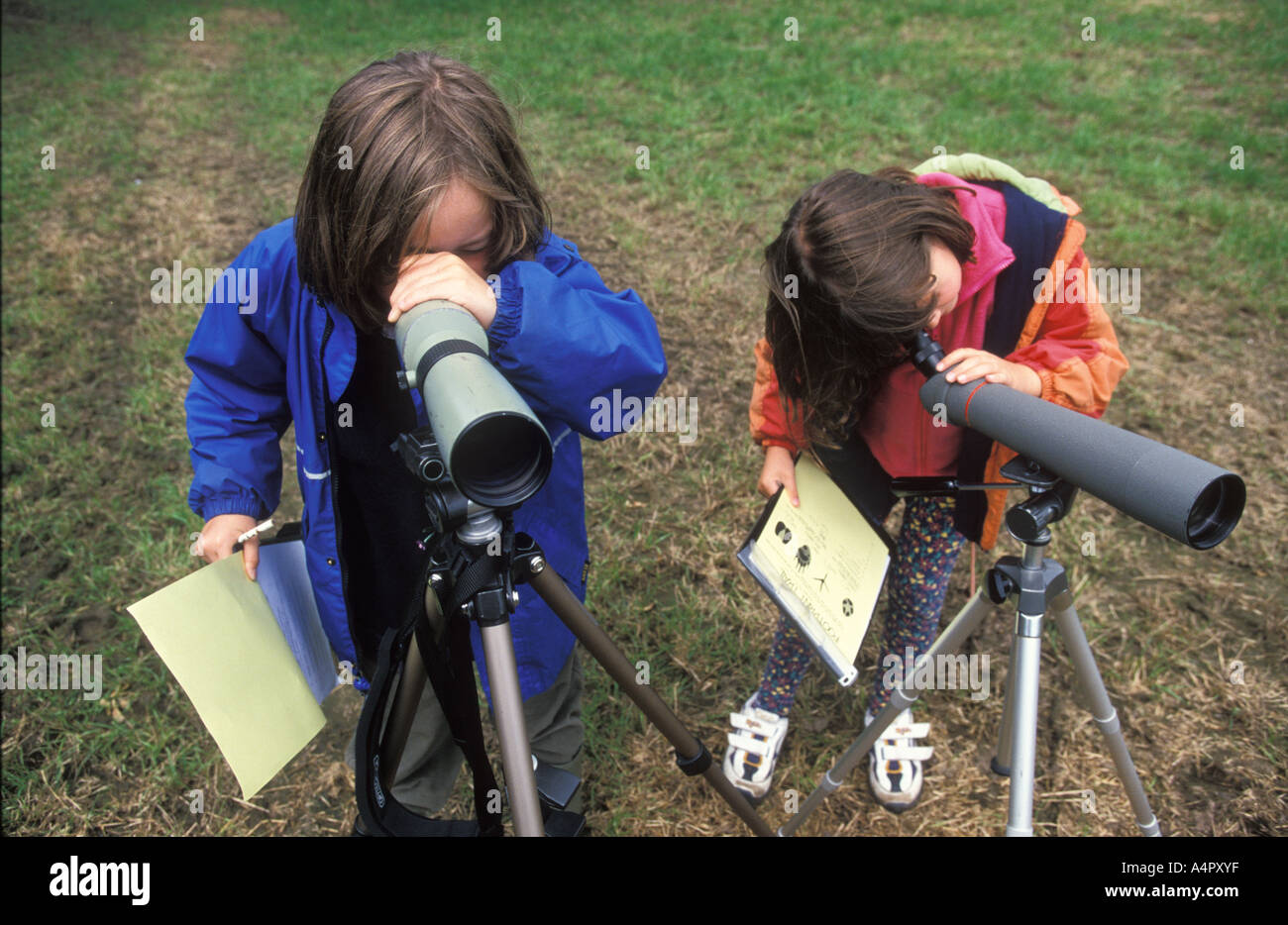 children looking through telescope Stock Photo - Alamy
