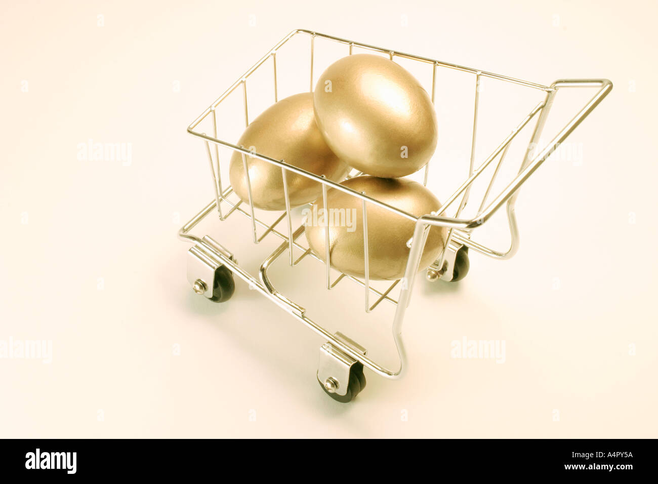 Golden Eggs in Miniature Trolley Stock Photo - Alamy