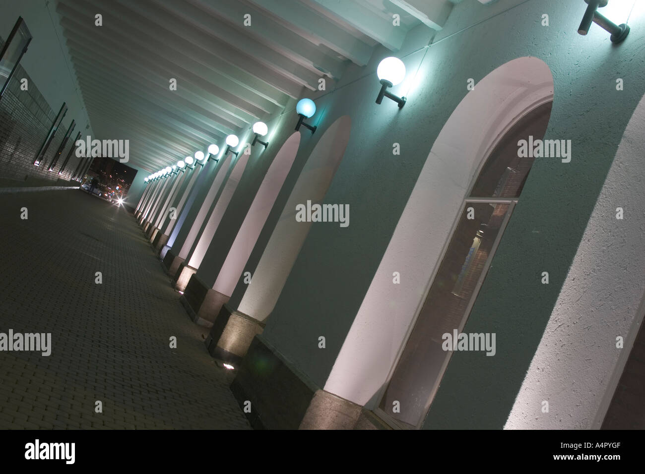 Lit up arches in a corridor Stock Photo - Alamy