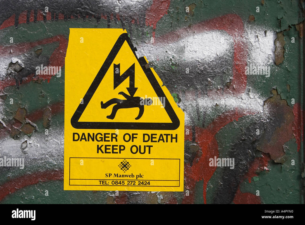 Danger sign board on a wall Stock Photo - Alamy