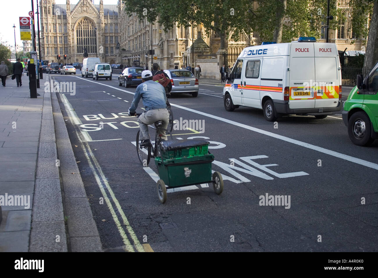 Rear view of a man pulling a cart Stock Photo - Alamy