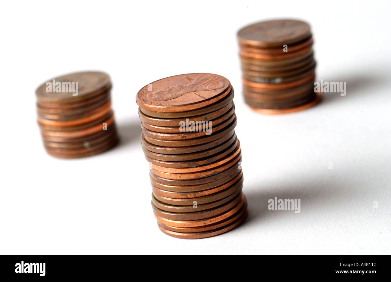 Color image of stocks of pennies on a white background Stock Photo - Alamy