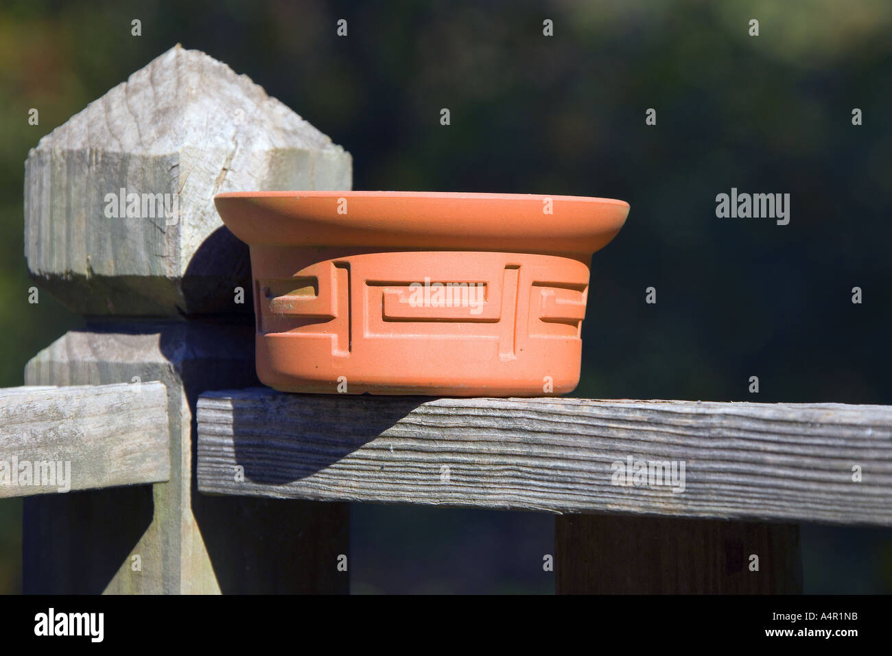 Pot on Fence Stock Photo - Alamy