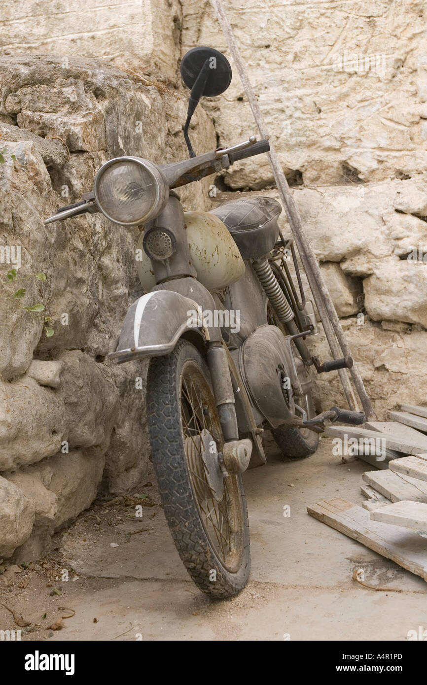An old motorcycle against a stone wall hi-res stock photography and ...