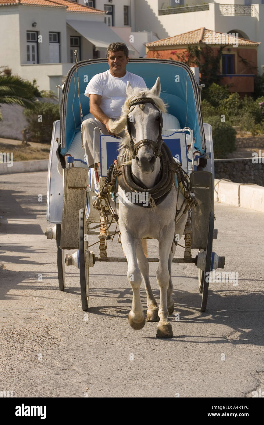 Mid adult man sitting on a carriage Stock Photo - Alamy