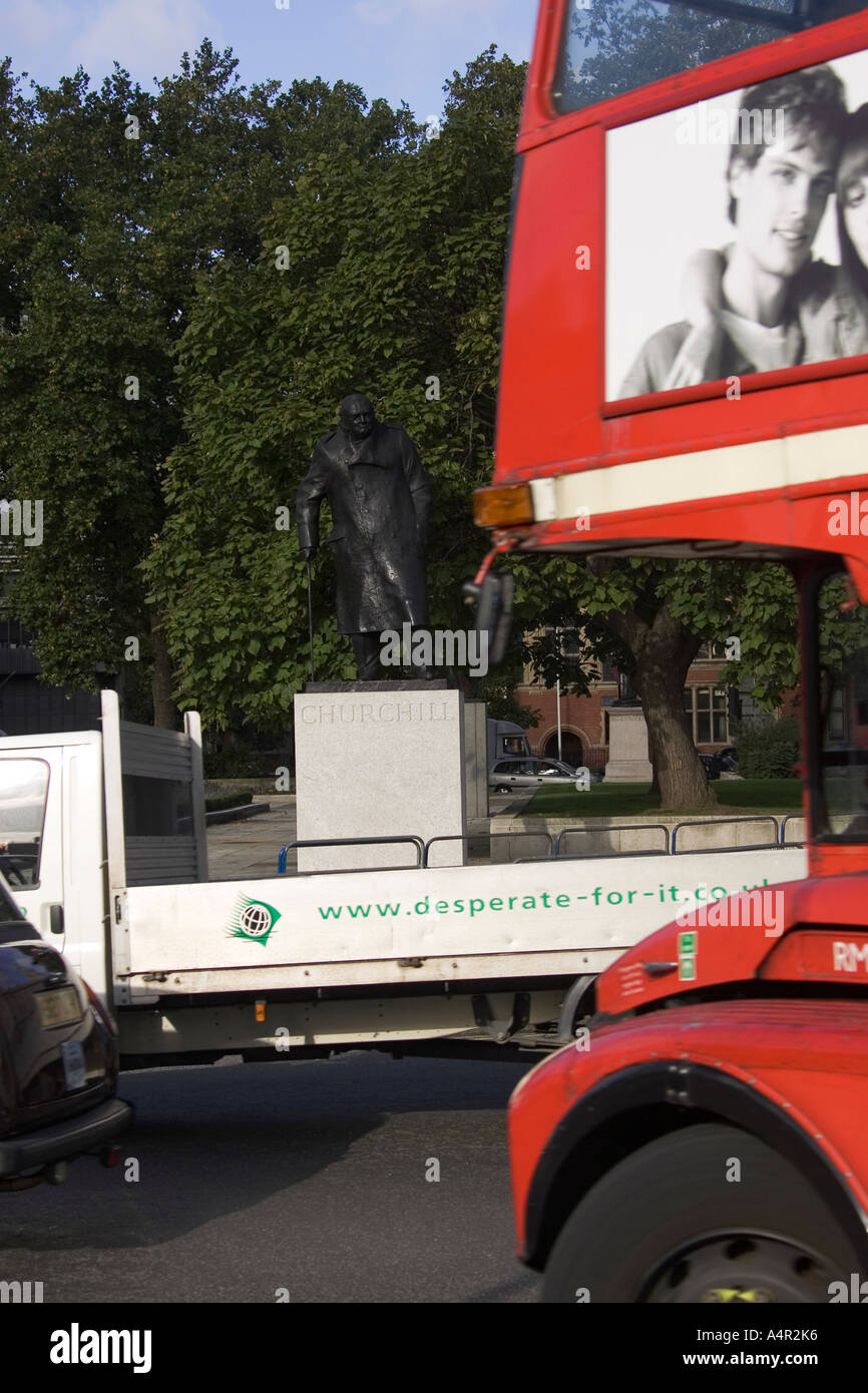 Trucks in front of a statue Stock Photo - Alamy