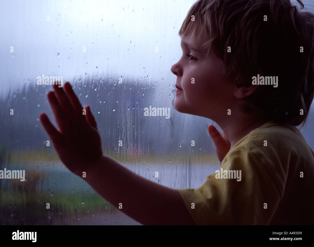 Child Looking Out Window Rainy Day High Resolution Stock Photography ...