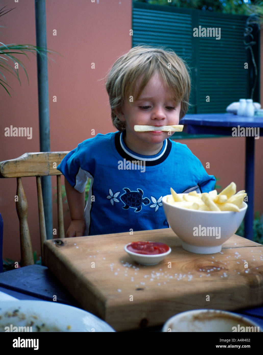 Boy chips ketchup hi-res stock photography and images - Alamy