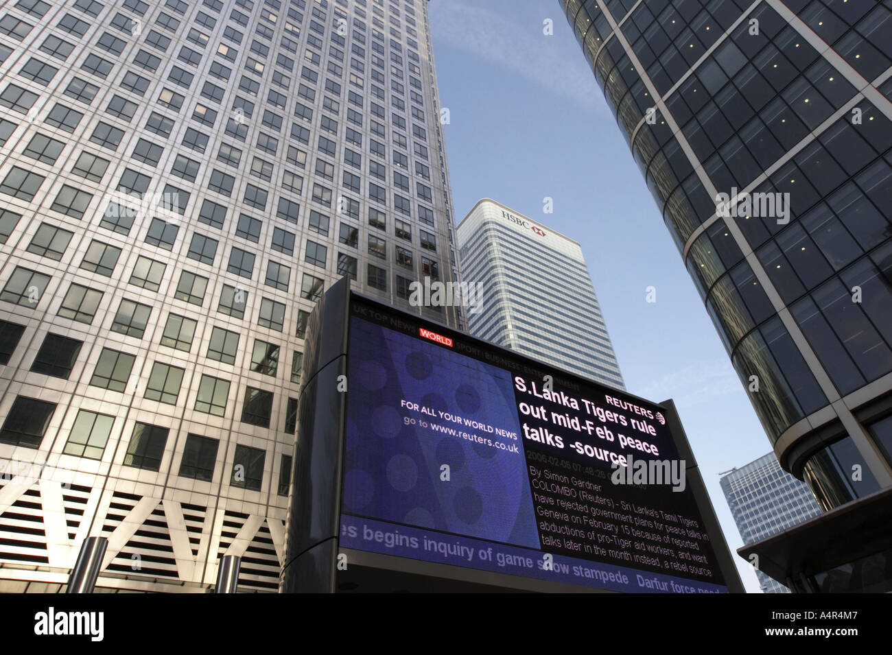Canary Wharf and Giant TV News Screen in London UK Stock Photo - Alamy