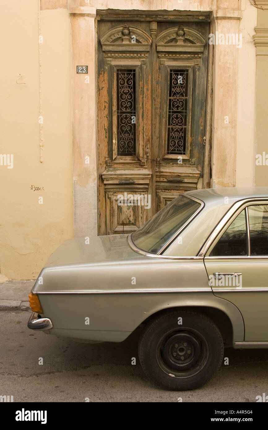 Close up of the rear of a car parked in front of a door Stock Photo - Alamy
