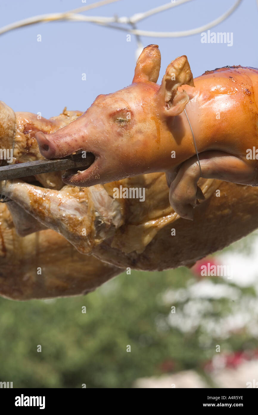 Pig being spit roasted hi-res stock photography and images - Alamy