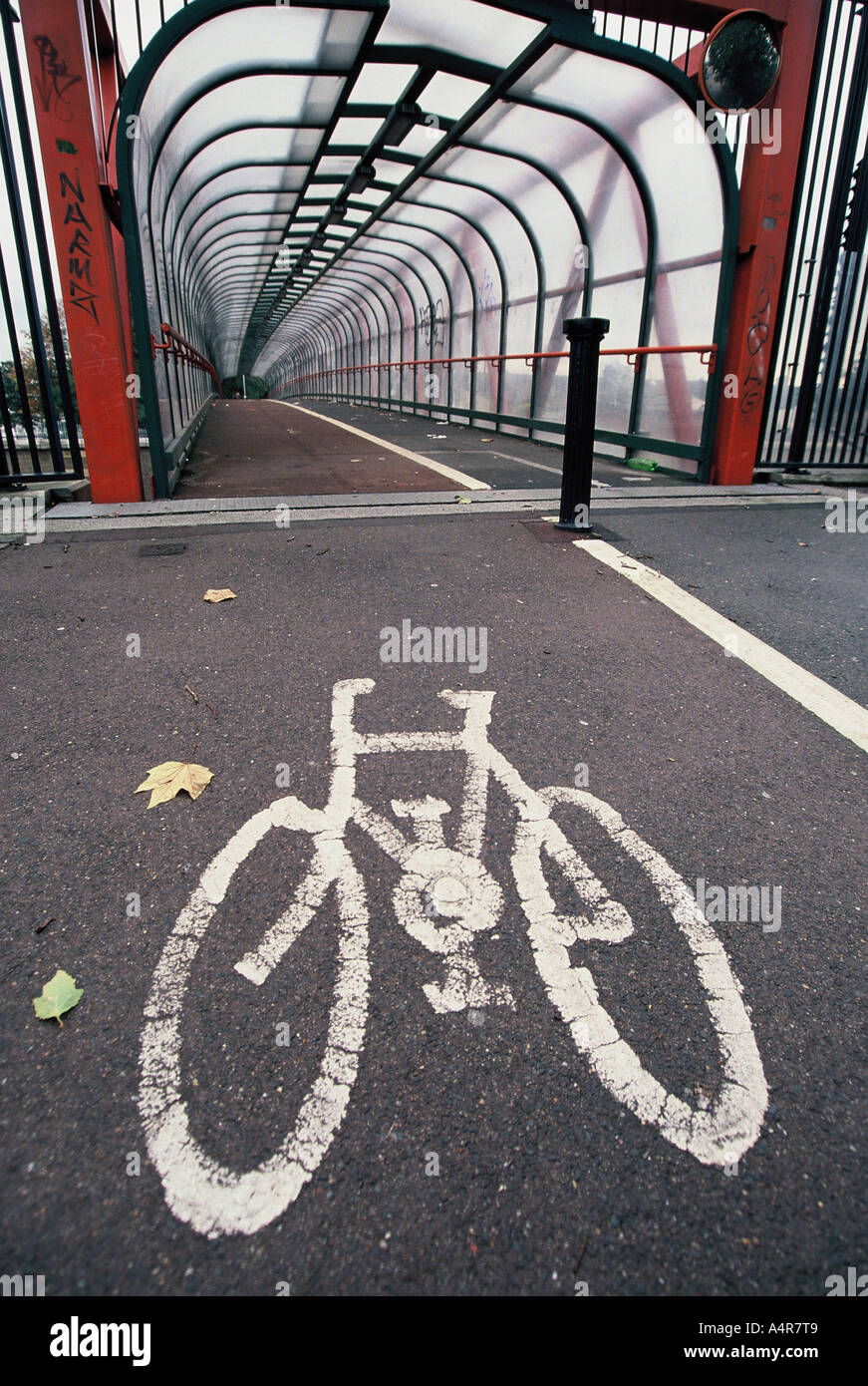 Cycle path markings and pedestrian bridge Stock Photo - Alamy