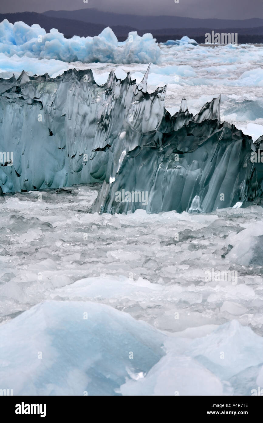 Jagged icebergs floating in sea ice near the San Rafael Glacier in ...