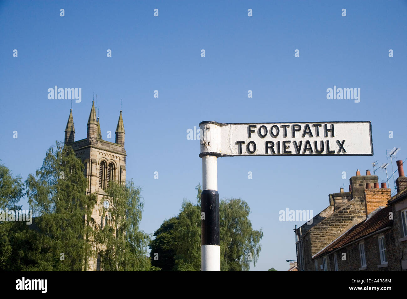 All Saints Church Helmsley with an old fashioned signpost showing ...