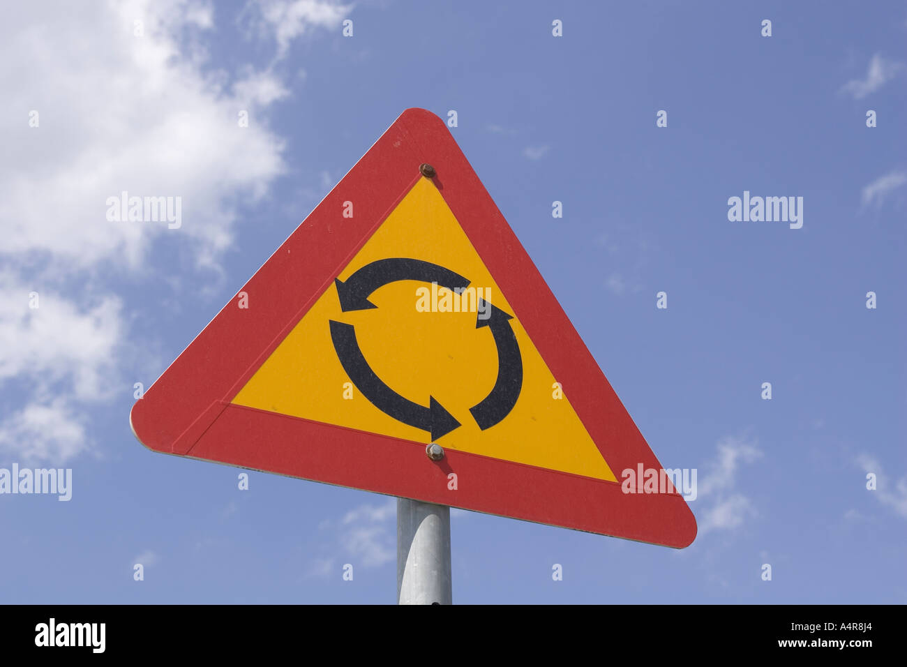 Close up of a roundabout sign board Stock Photo - Alamy